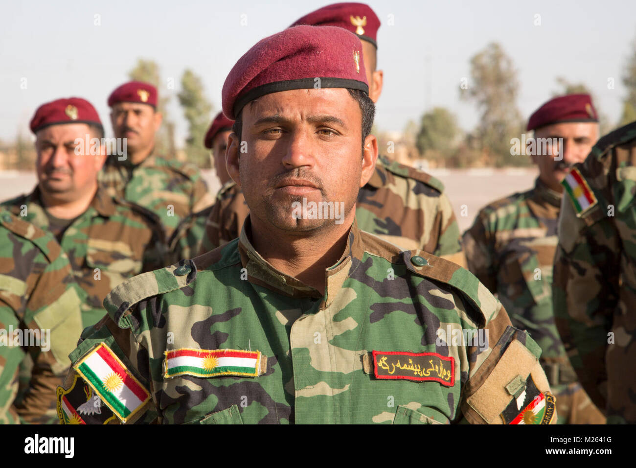 Peshmerga soldiers wait for a command from British army trainers during ...