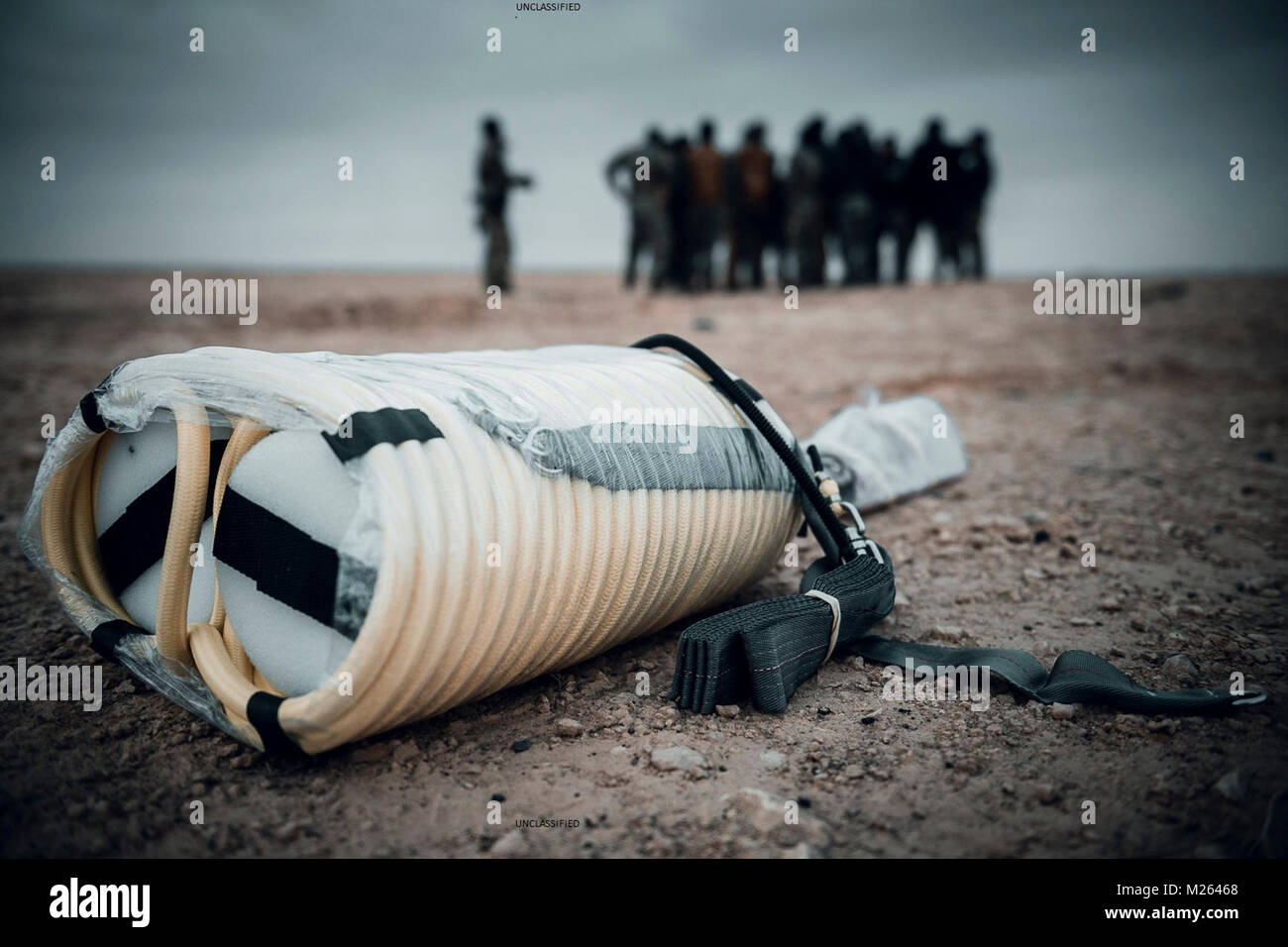 A training improvised explosive device lies on the ground at the site ...