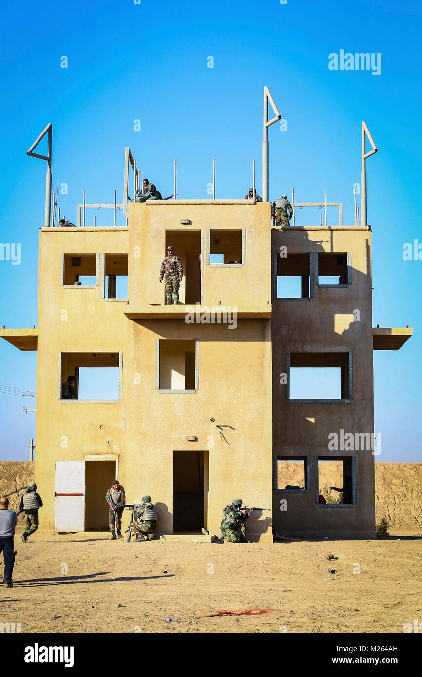 Iraqi soldiers attached to the 57th Brigade conduct an assault during ...