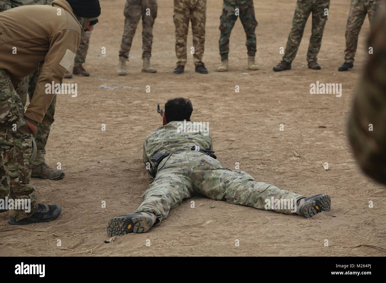 An Italian coalition member shows Iraqi soldier’s the correct form of ...