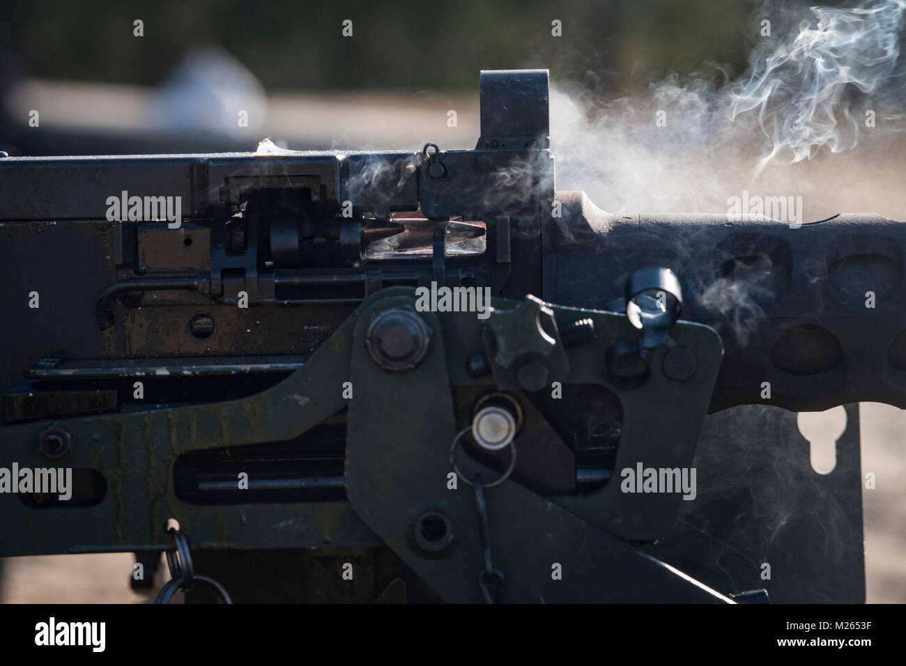 A .50 caliber round travels through an M2 machine gun, Jan. 23, 2018 ...