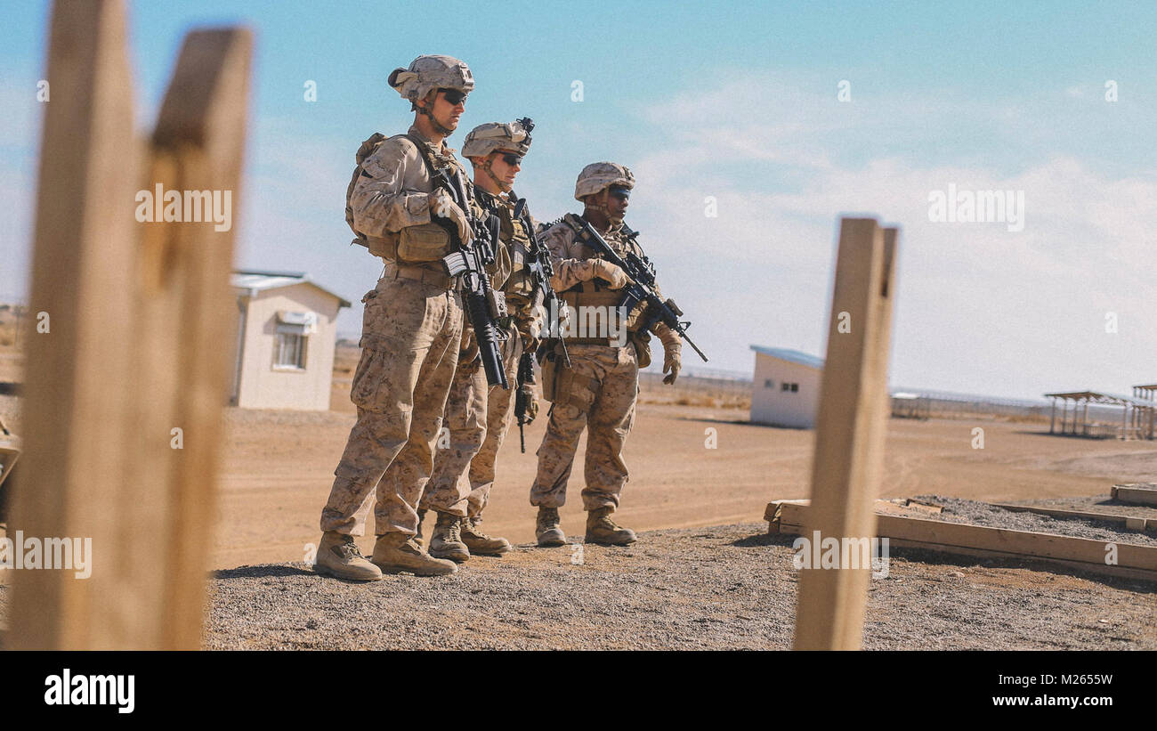 U.S. Marines with Task Force Southwest assess the integrity of a ...