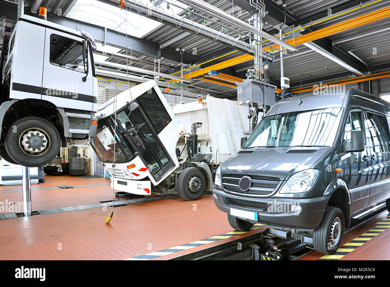 vehicles in a garage - repair and inspection of cars on a lifting ...