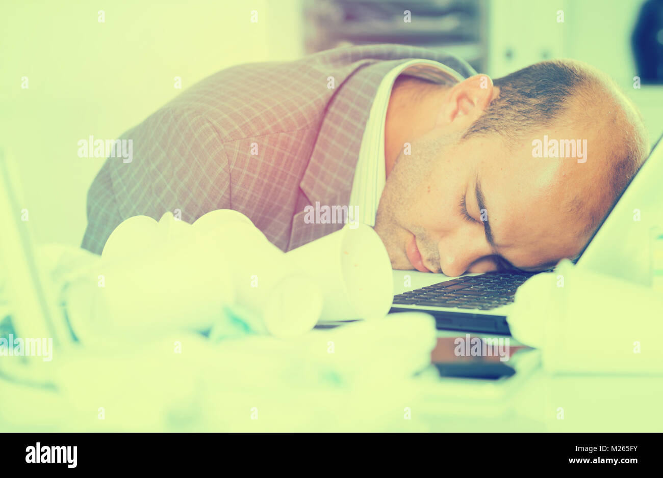 Young sad man tired of working and sleeping in the modern office Stock ...