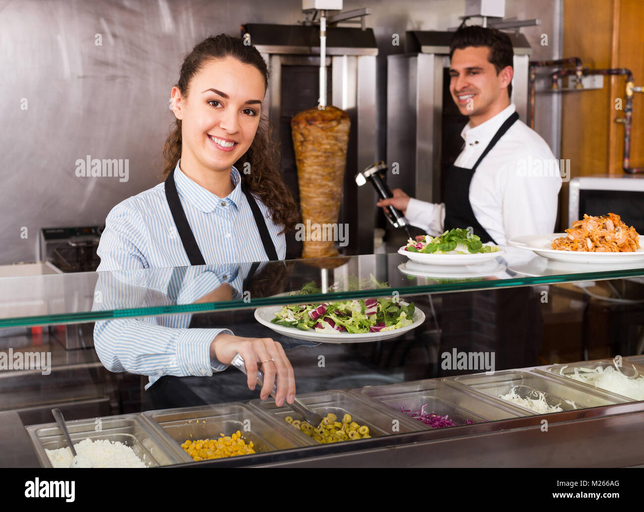 Portrait of workers with kebab at fastfood place Stock Photo - Alamy