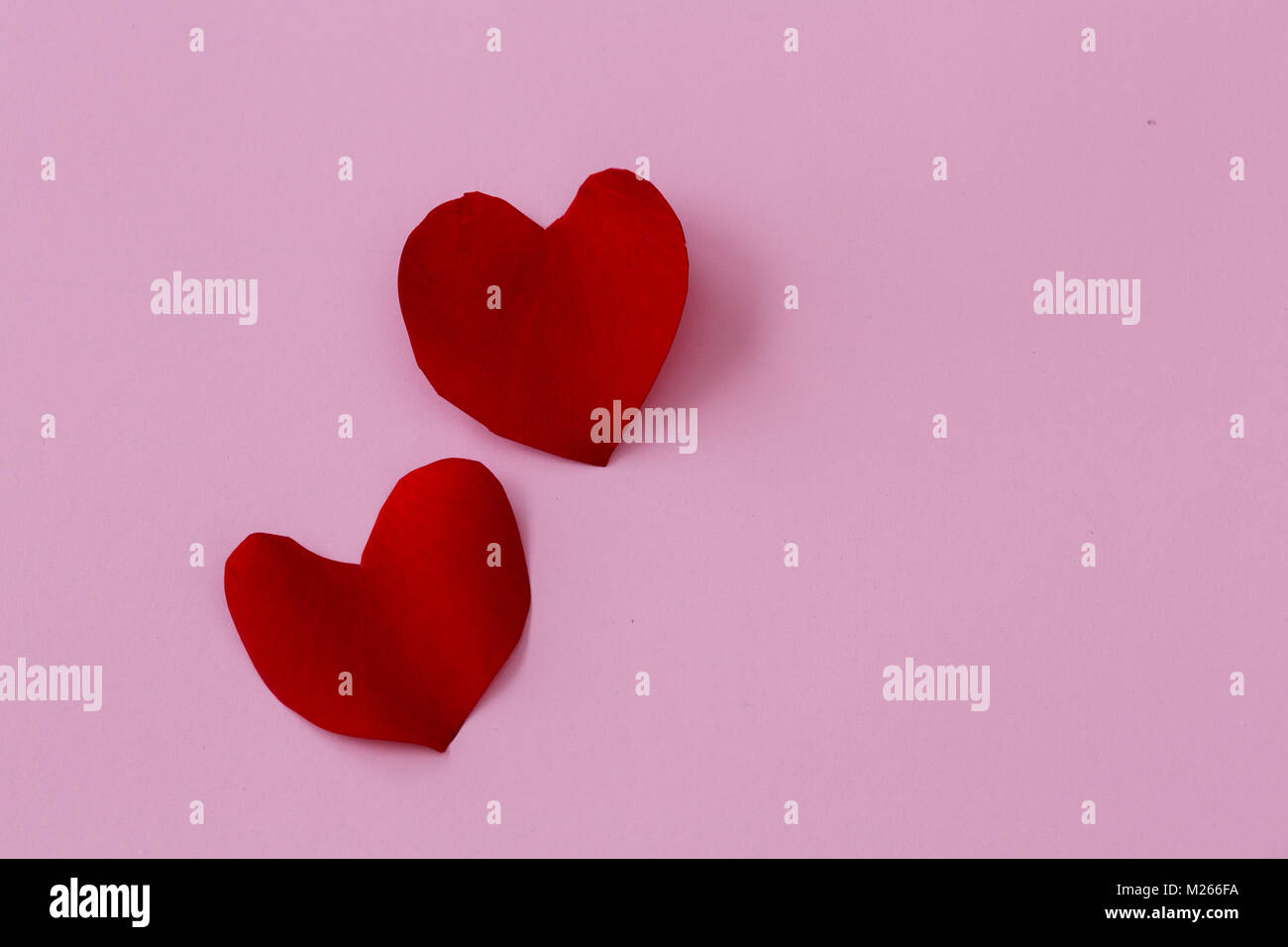 Two heart shaped rose petals Stock Photo - Alamy