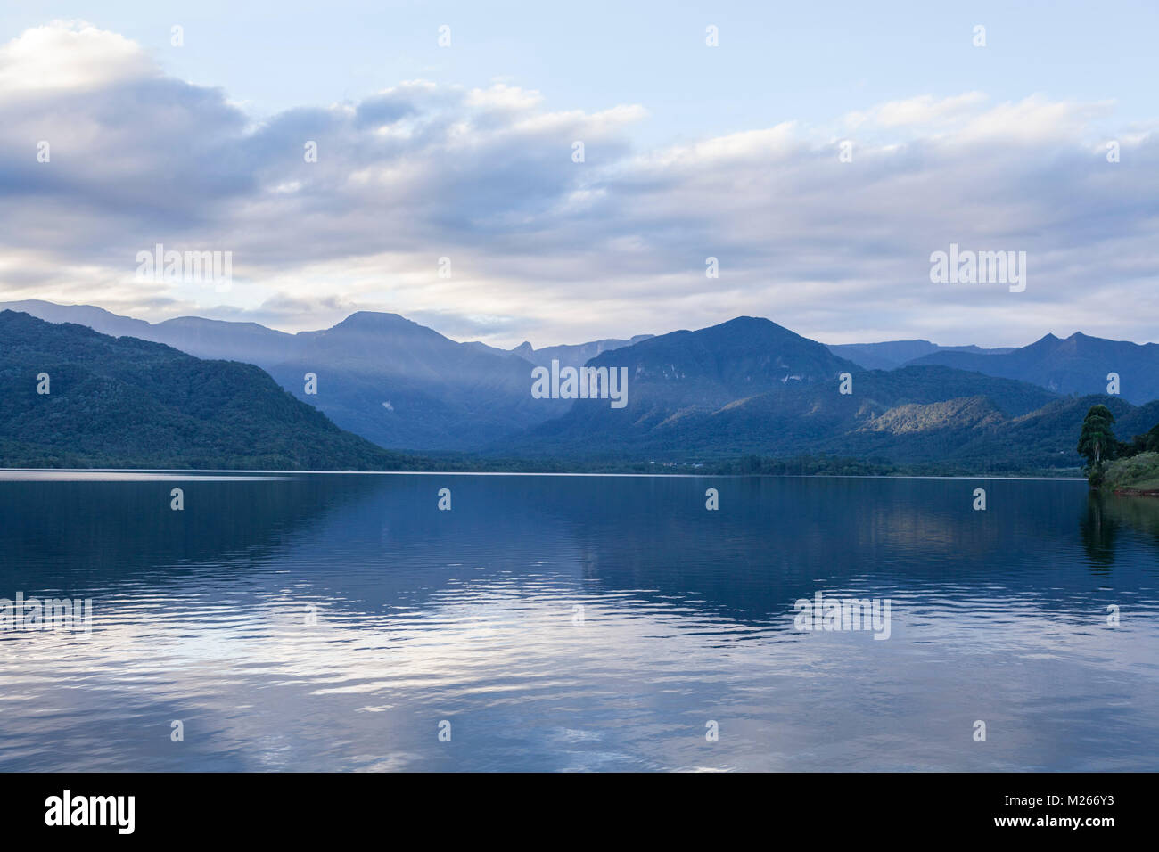 Mountains Reflecting On Water Stock Photo - Alamy
