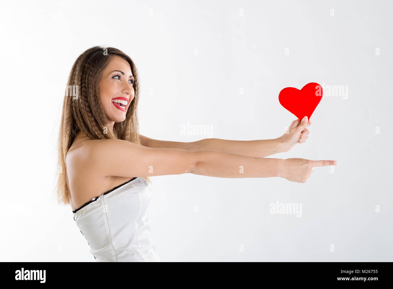 Cheerful beautiful girl holding hi-res stock photography and images - Alamy