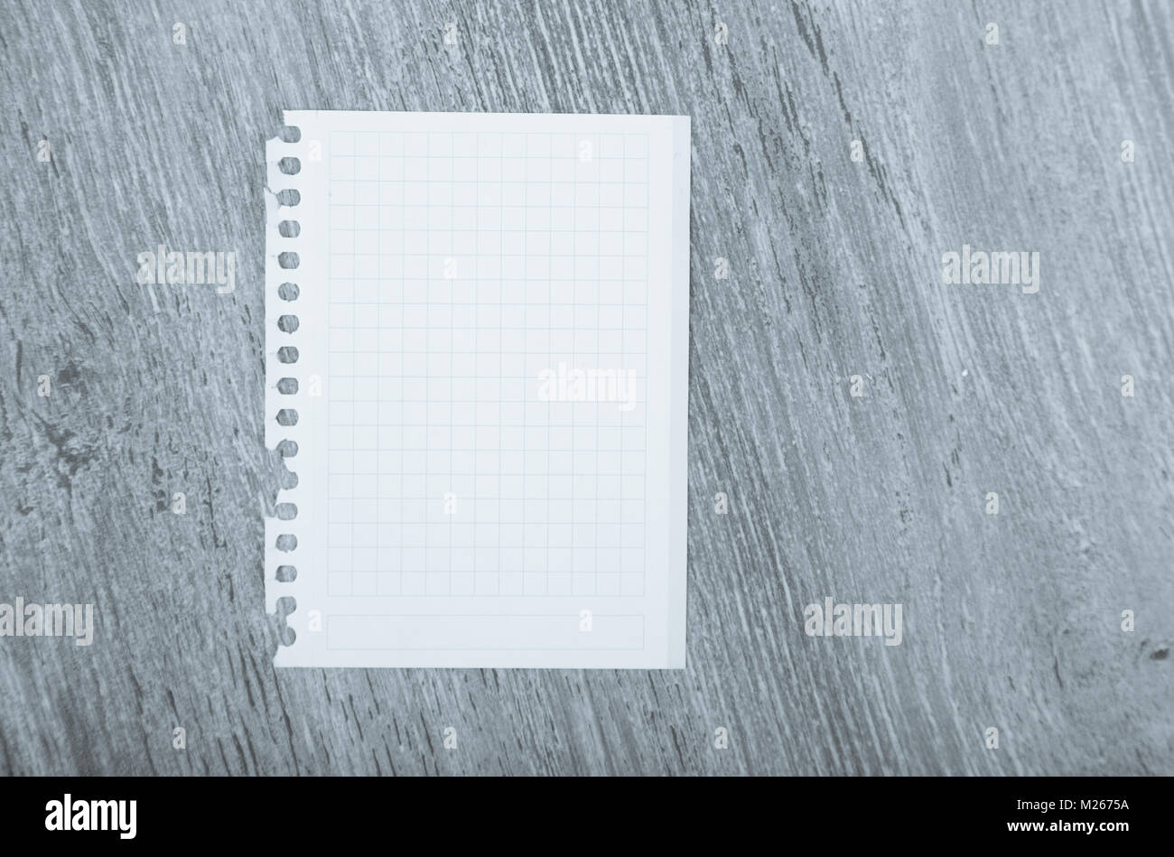 Empty torn page from notebook lying on wooden surface Stock Photo - Alamy