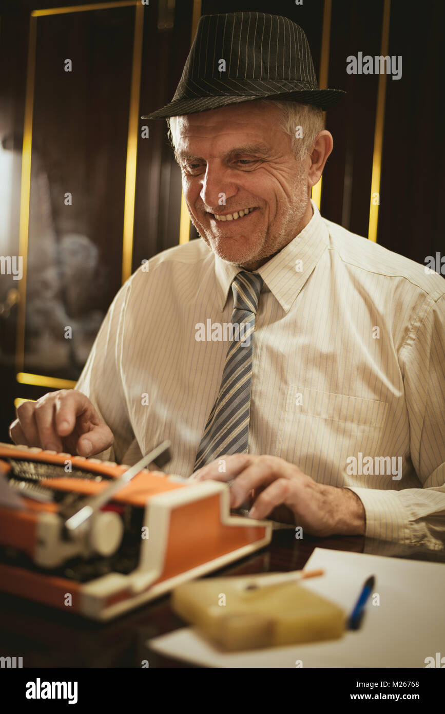 Serious senior writer reading hi-res stock photography and images - Alamy