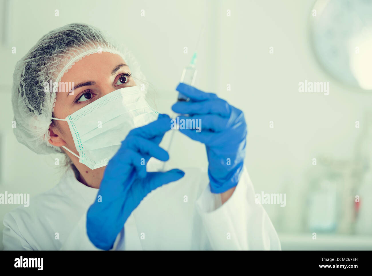 Professional nurse woman making injection in hospital Stock Photo - Alamy