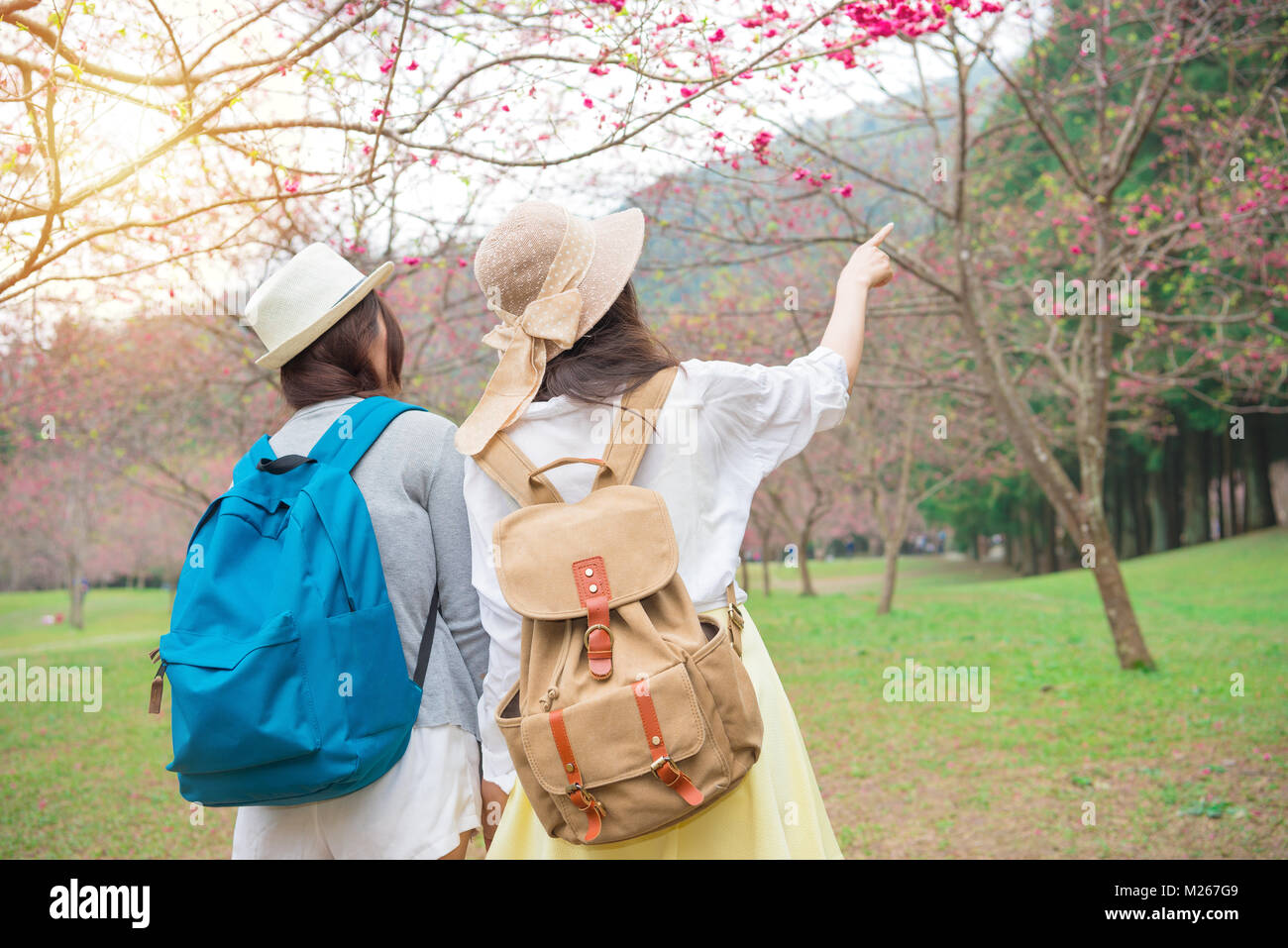Young female backpackers happy hi-res stock photography and images - Alamy
