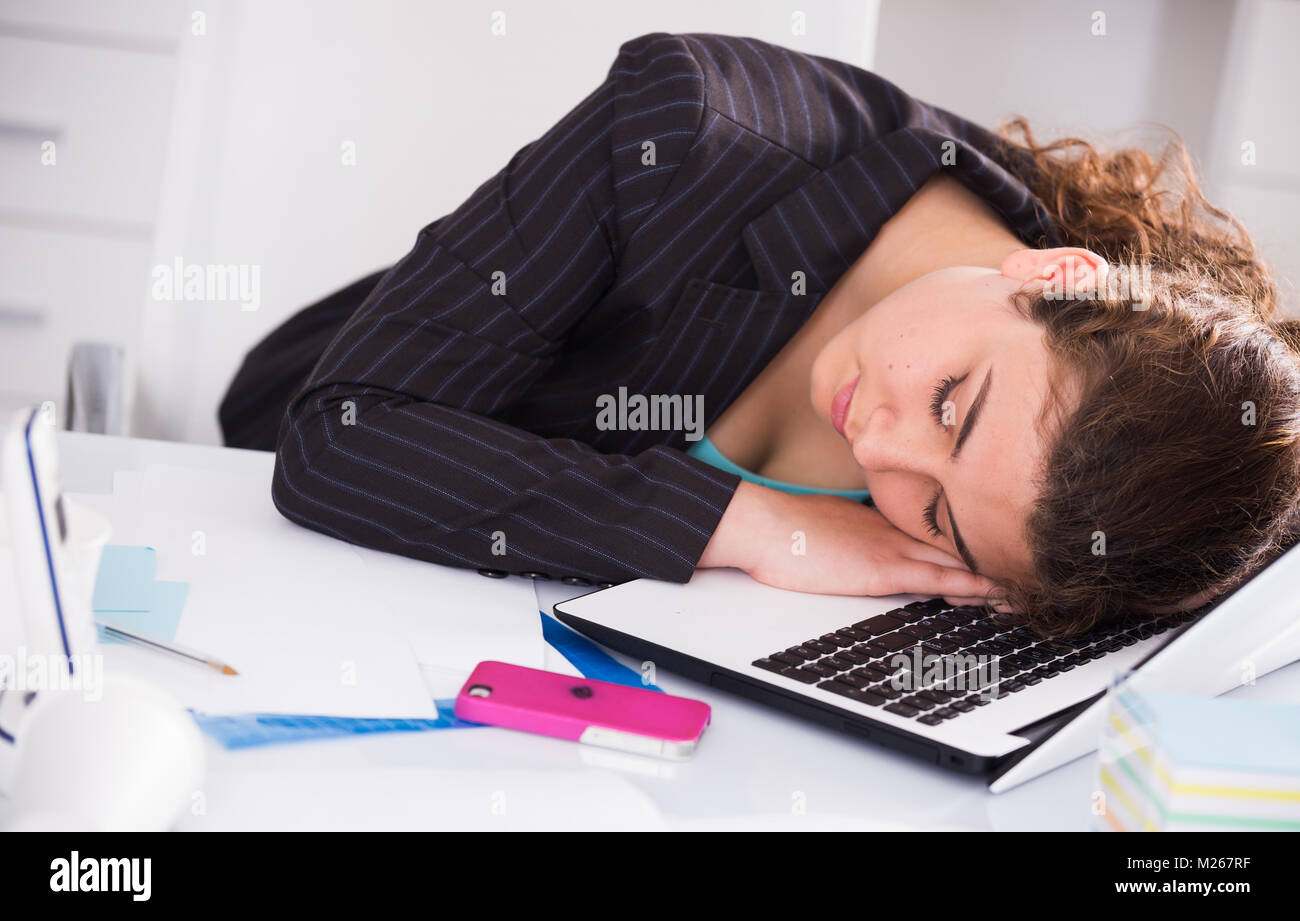 Female manager is sleeping after productive day at work in office Stock ...