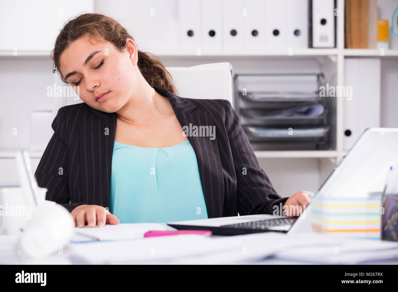 Employee is sleeping at work after putting the reports in the office ...