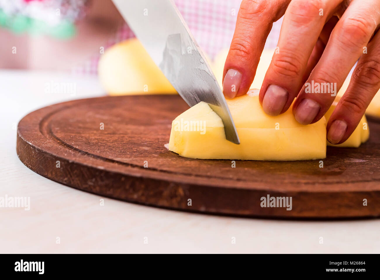 Woman hands cutting potatoes hi-res stock photography and images - Alamy