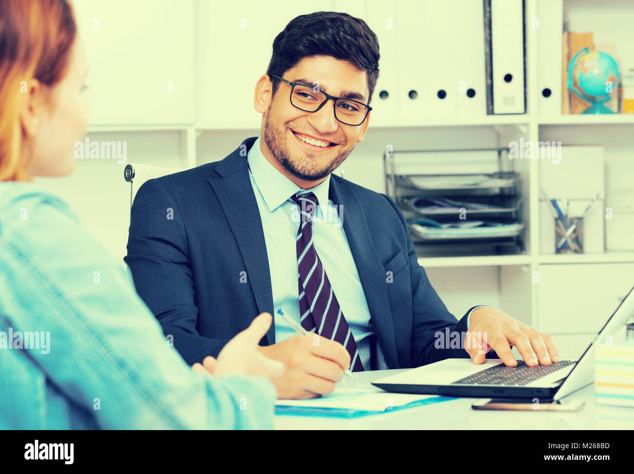 Colleagues meeting and having discussion in office Stock Photo - Alamy