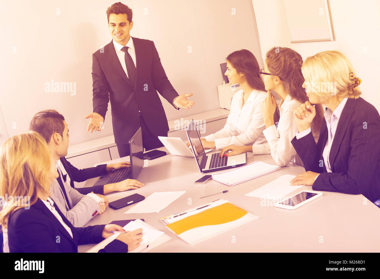 Chief with professional happy russian officials discussing preparing ...