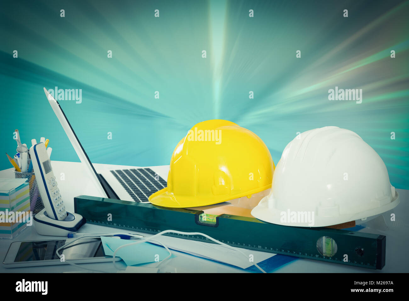 Engineering tools on office desk on background of bright divergent rays ...