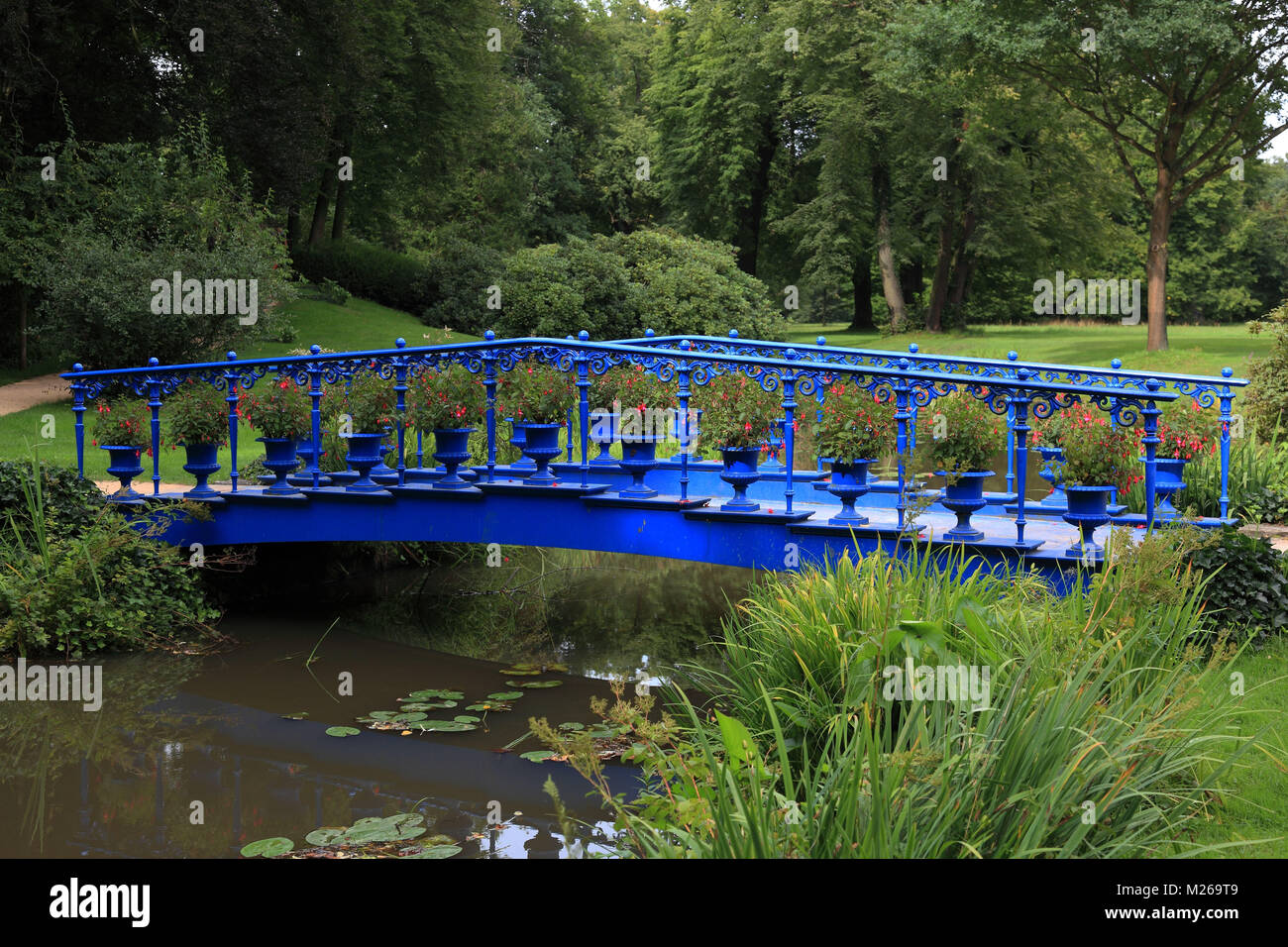 Blue Bridge in the park landscape, potted plants, fuchsias, Bad Muskau ...