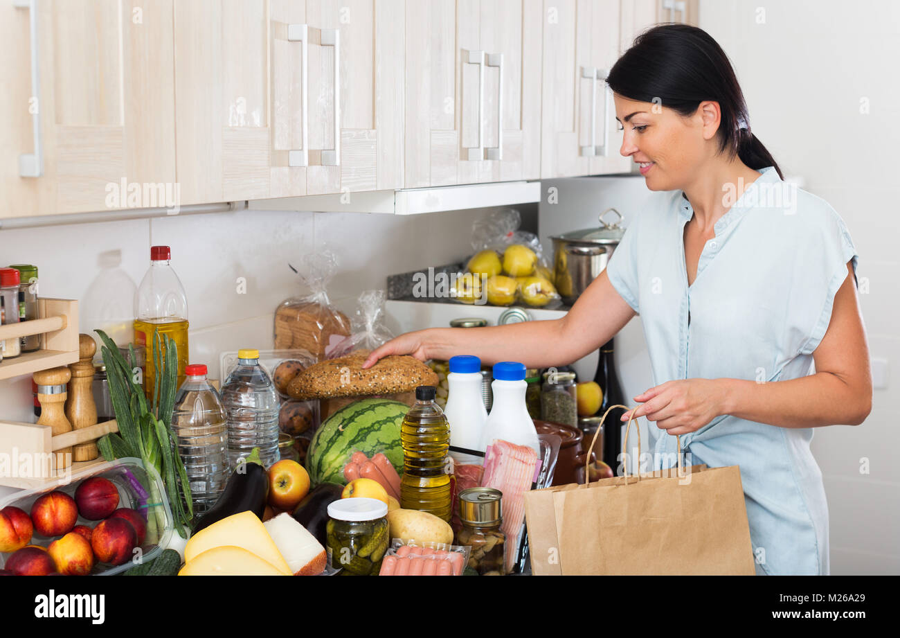 Female is posing in time cooking on the kitchen at home Stock Photo - Alamy
