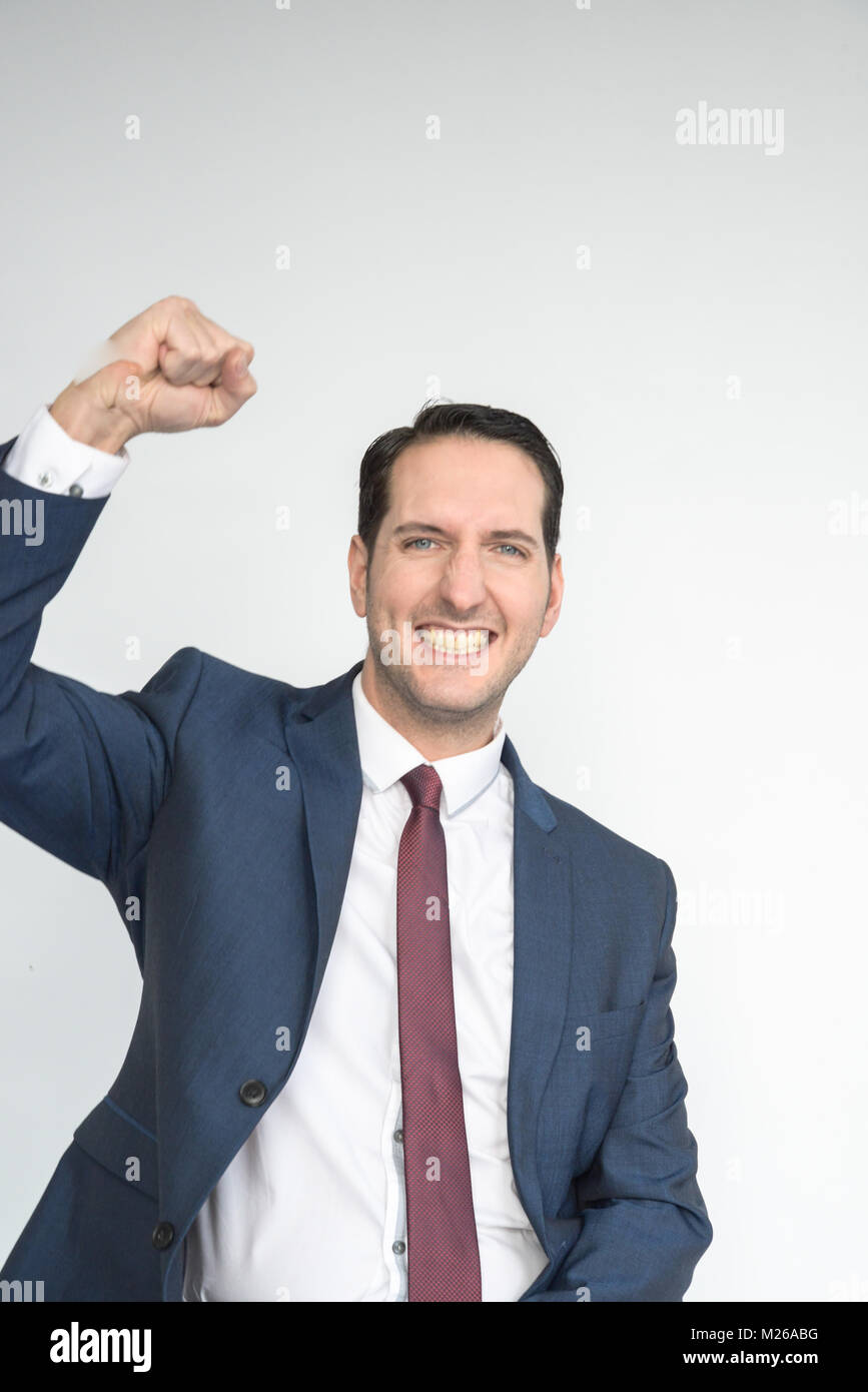 Portrait of a smartly dressed good looking man smiling and happy ...