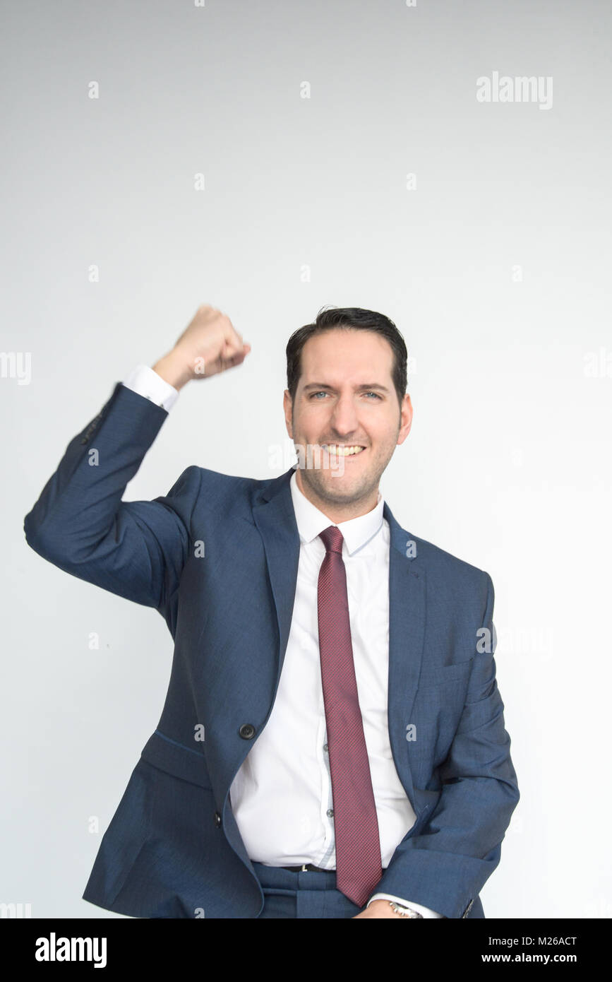 Portrait of a smartly dressed good looking man smiling and happy ...
