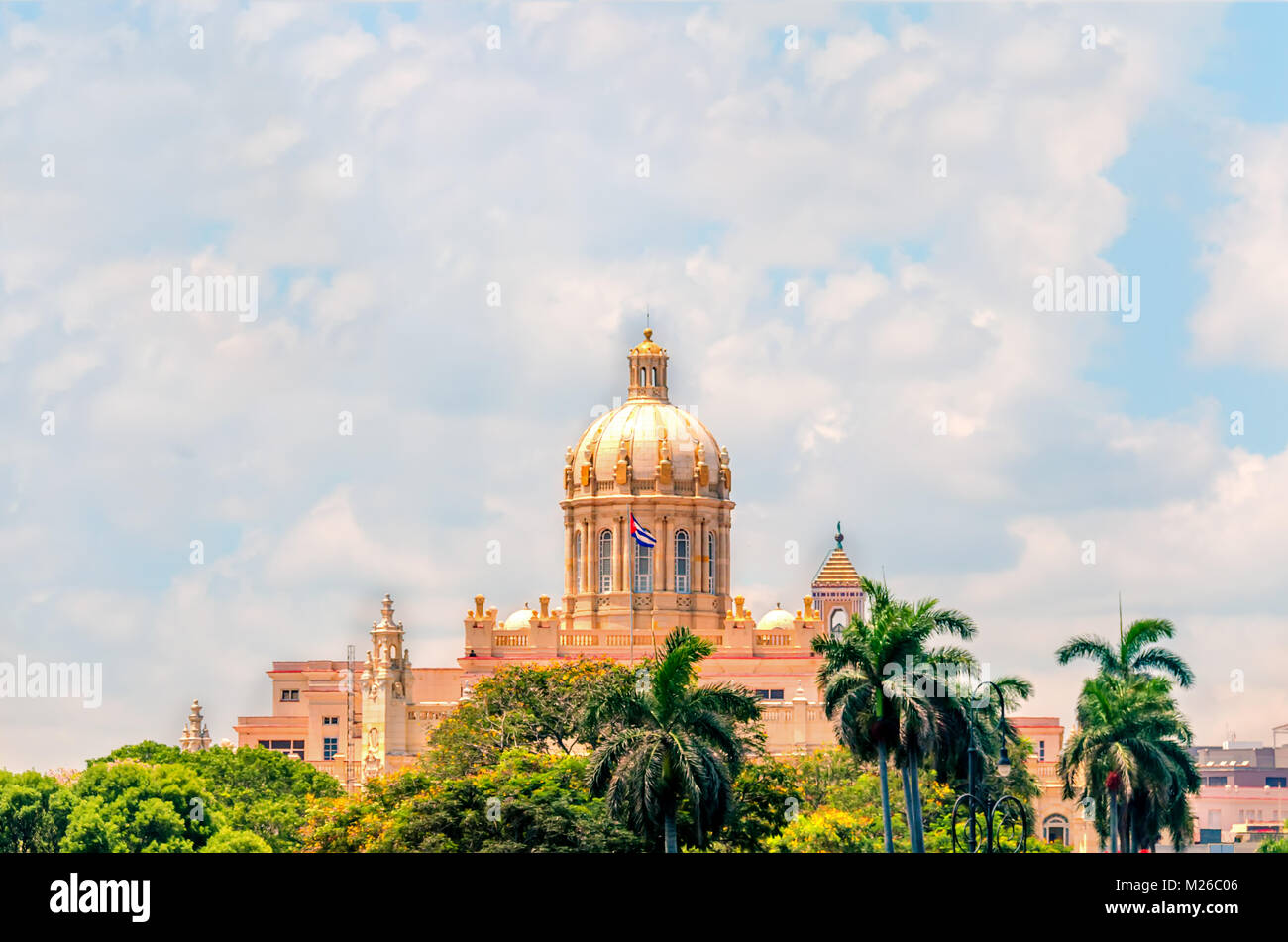 Yellow dome of an ancient historic building with a flag of cubes ...