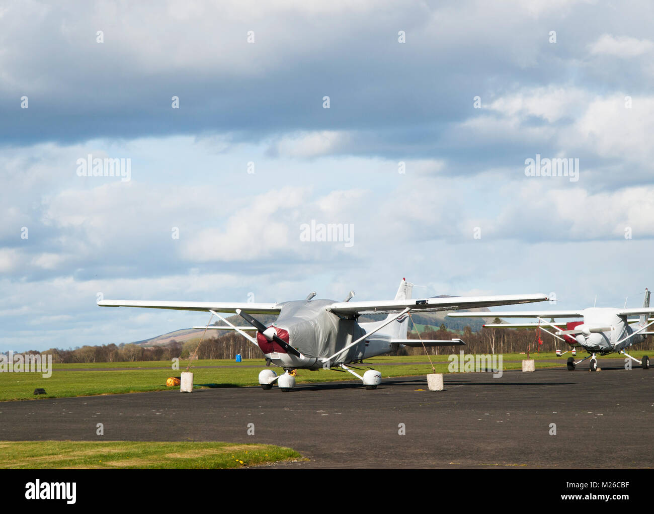 Small single-engine airplane parjed on runway Stock Photo - Alamy