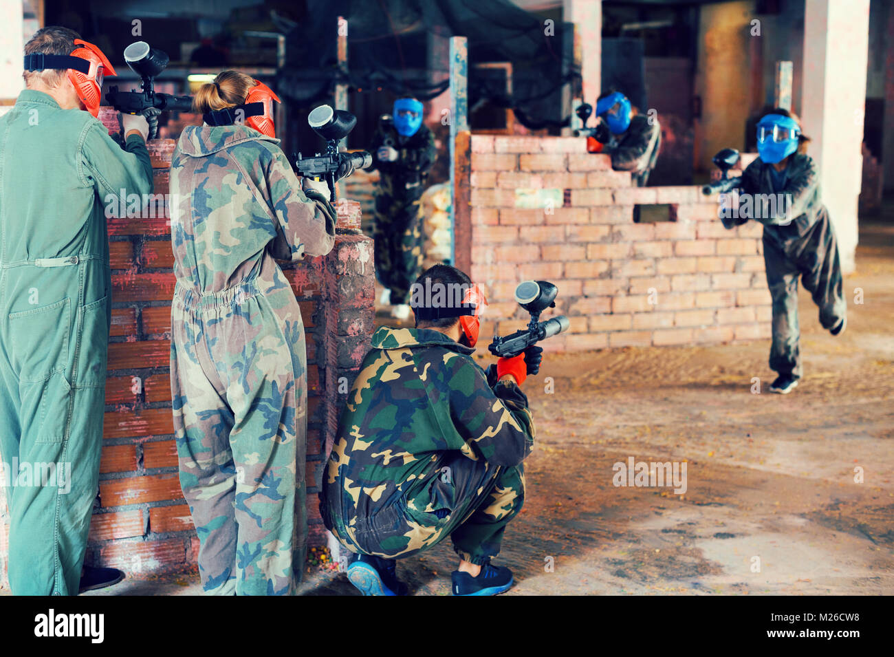 Players of blue and red team are having fun on the battlefiled on the ...