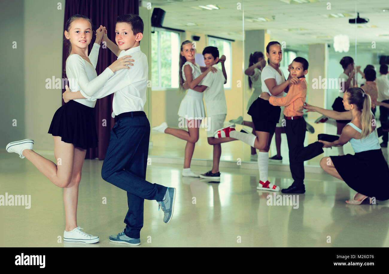 Pairs of kids are dancing tango in class Stock Photo - Alamy