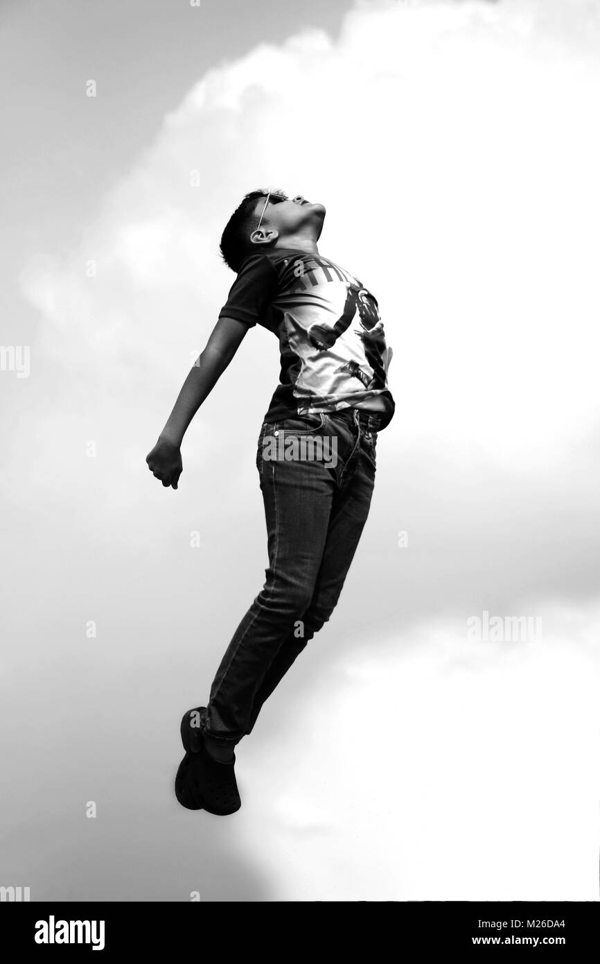 Boy jumping high Stock Photo - Alamy