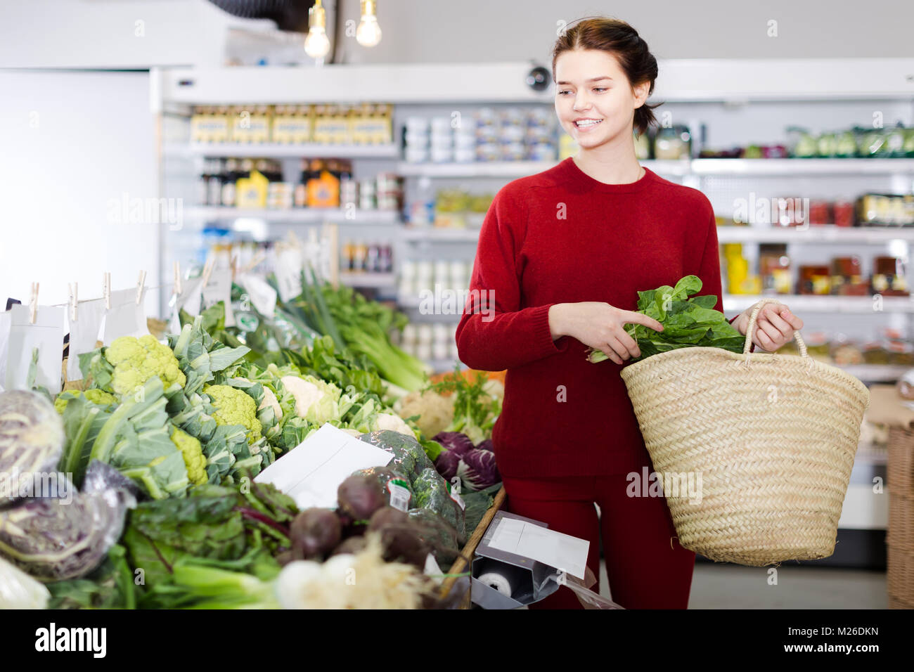 Female buyer shopping at a grocery store Stock Photo - Alamy