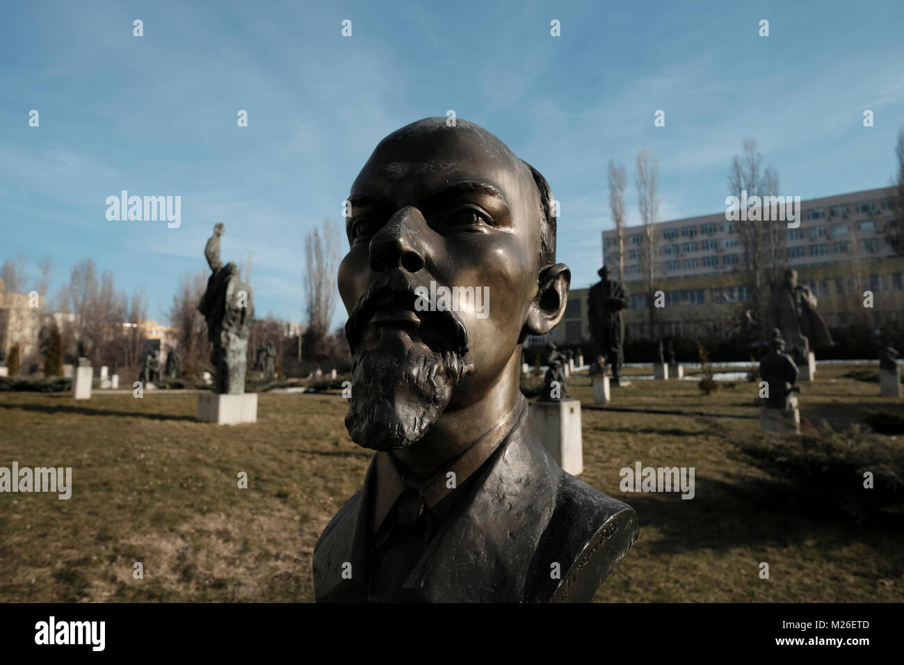 Soviet-era bust of Vladimir Lenin stands amid sculpture installations ...