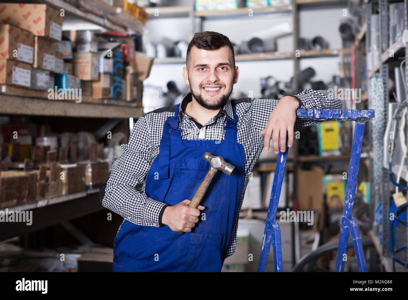 Male builder demonstrating his constructing tools at workshop Stock ...
