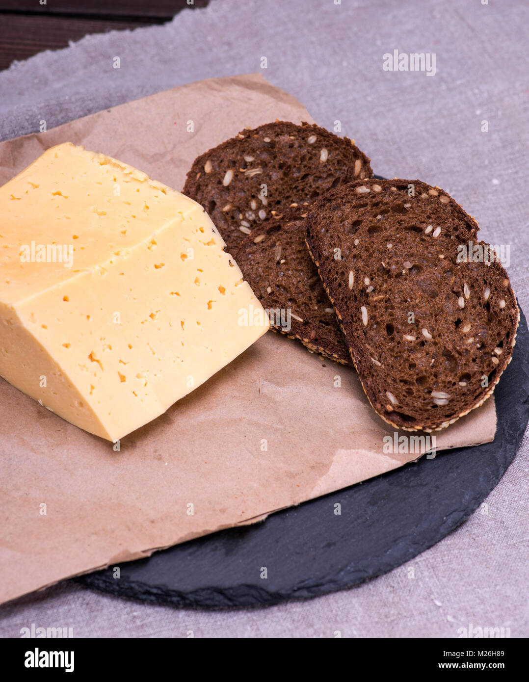 piece of cheese and slices of rye bread with seeds, top view Stock ...