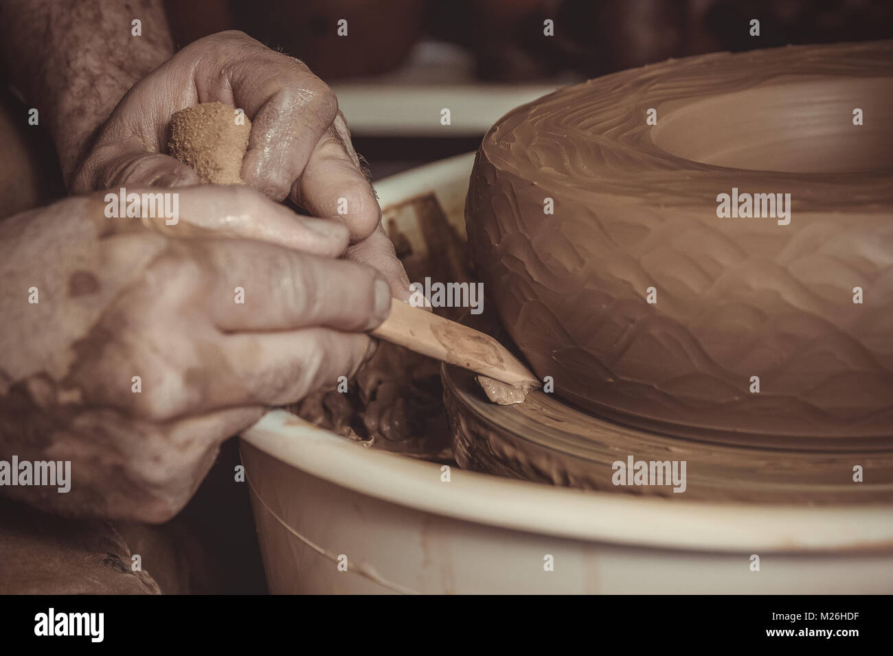 elderly man making pot using pottery wheel in studio Stock Photo - Alamy
