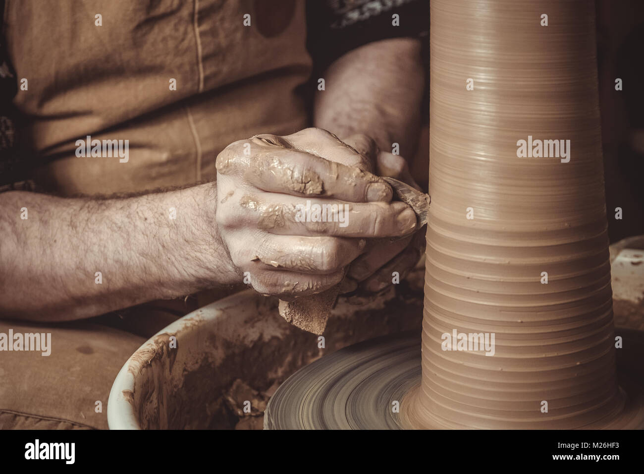 elderly man making pot using pottery wheel in studio Stock Photo - Alamy