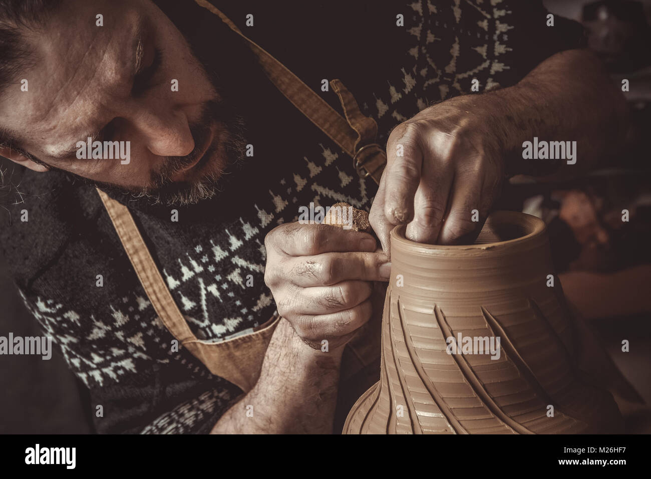 elderly man making pot using pottery wheel in studio Stock Photo - Alamy