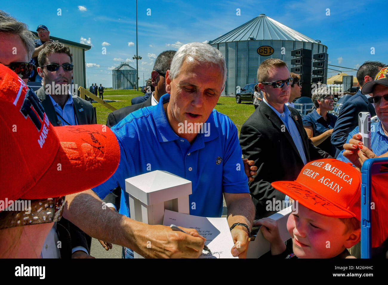 Vice President Mike Pence, shakes hands and signs autographs as he ...