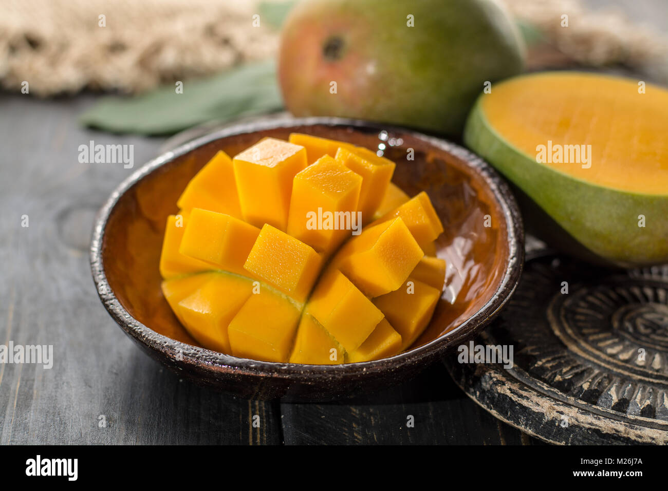 Tropical healthy fruit ripe organic mango close up in pieces ready to ...