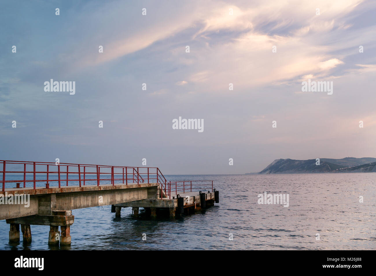 Close-up of the shipping pier on the sea at dawn Stock Photo - Alamy