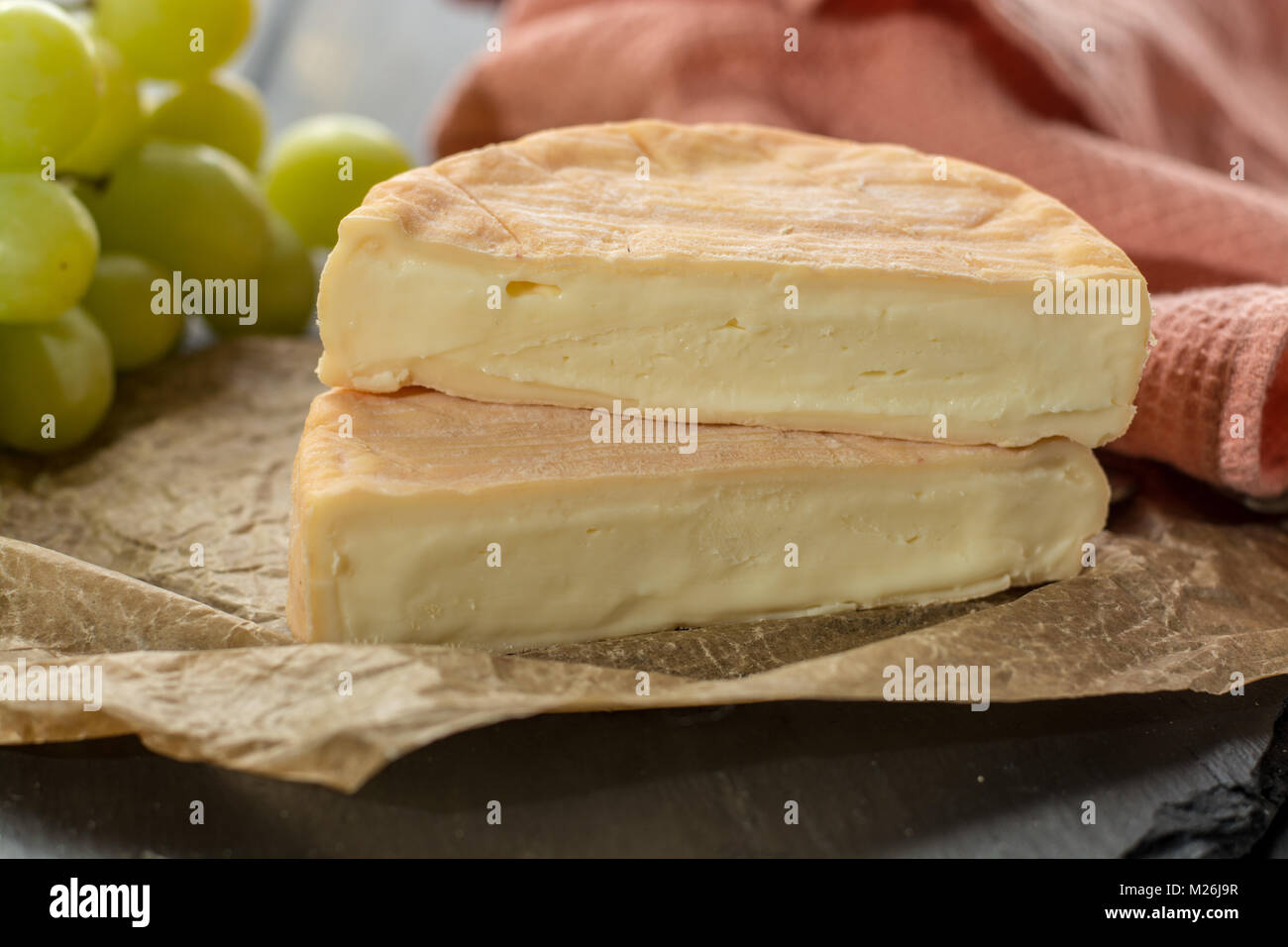 French soft strong smelling cheese Munster from Alsace close up Stock ...