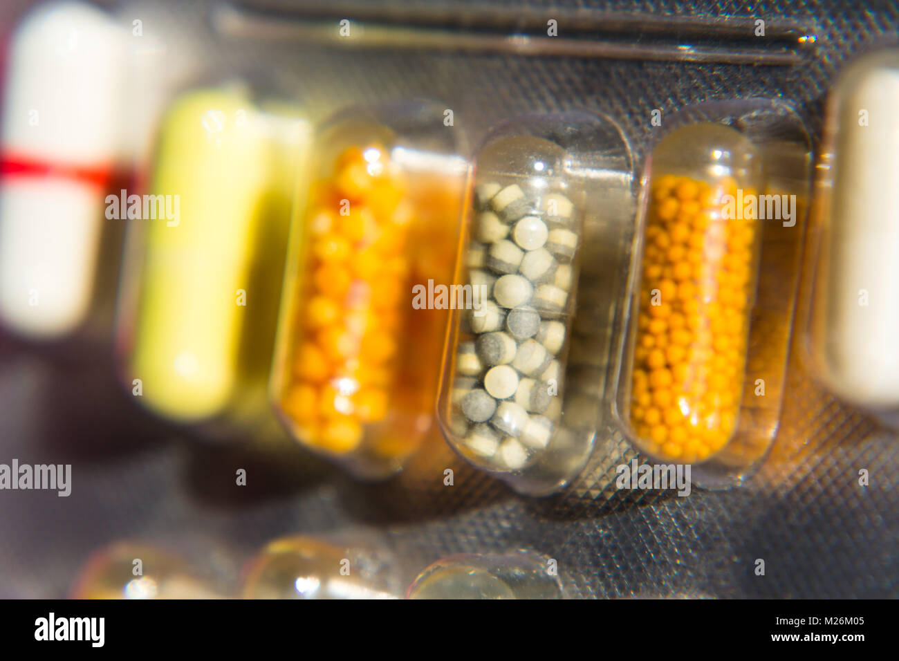 Colorful pills medicine capsule in transparent medicine capsule ...