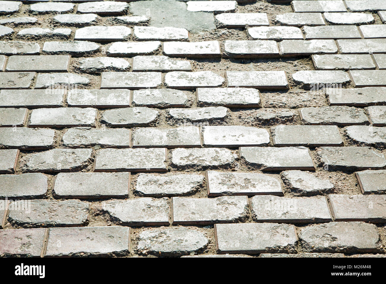 broken paving stones on the road close-up on a summer day Stock Photo ...