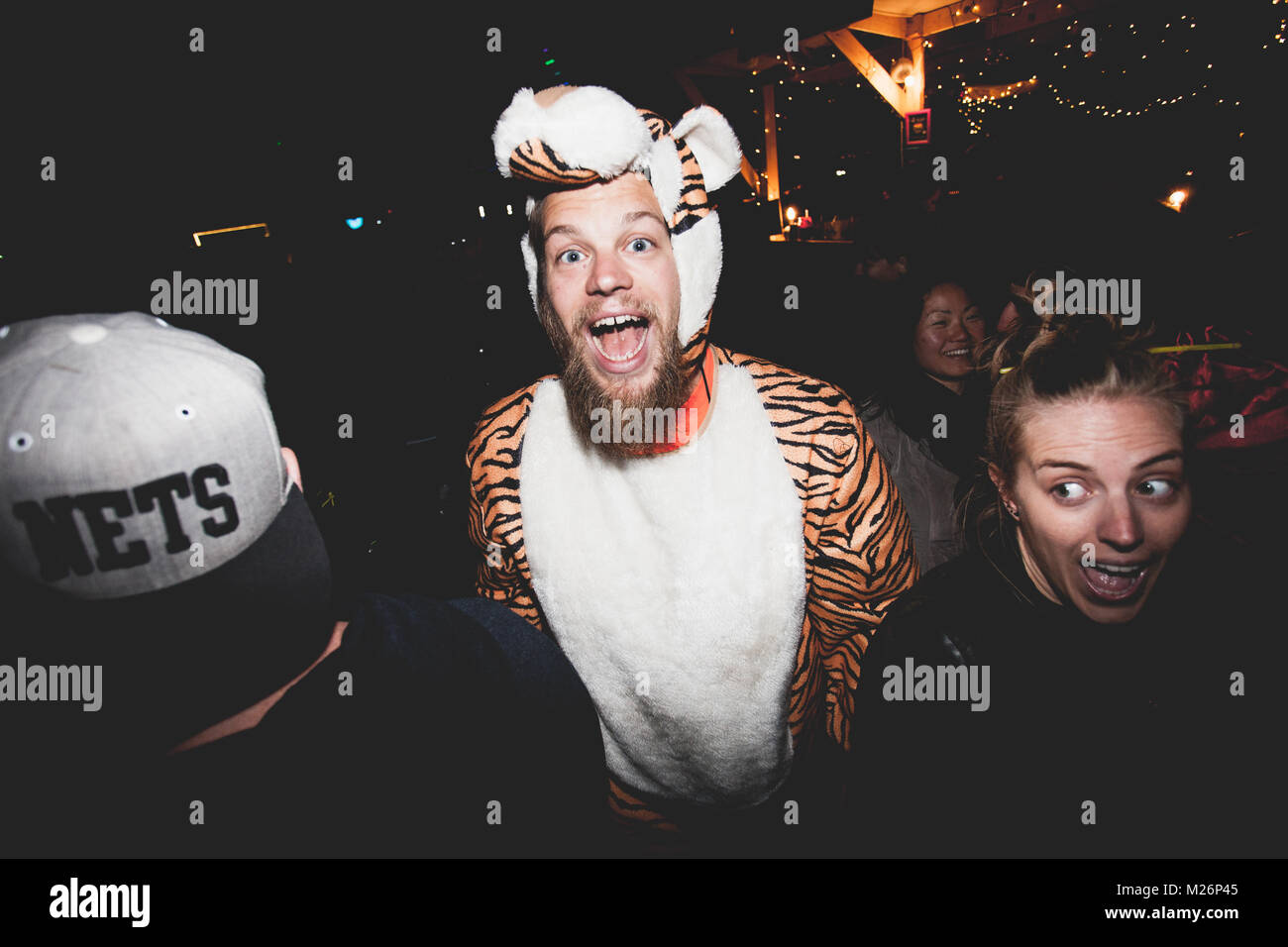 Party people are dancing, drinking and having fun at the annual block ...