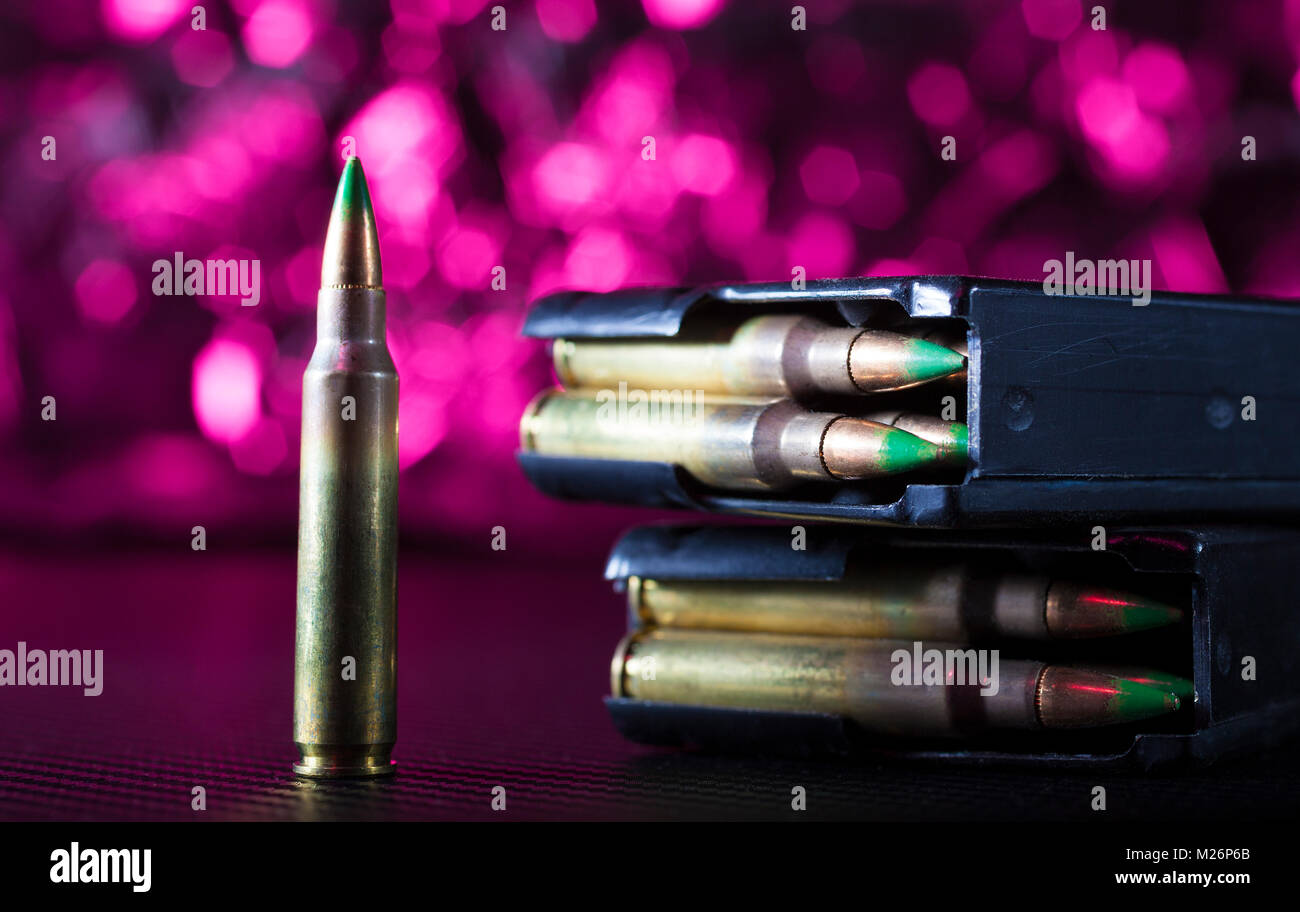 M855 ammunition with two metal magazines and purple behind Stock Photo ...