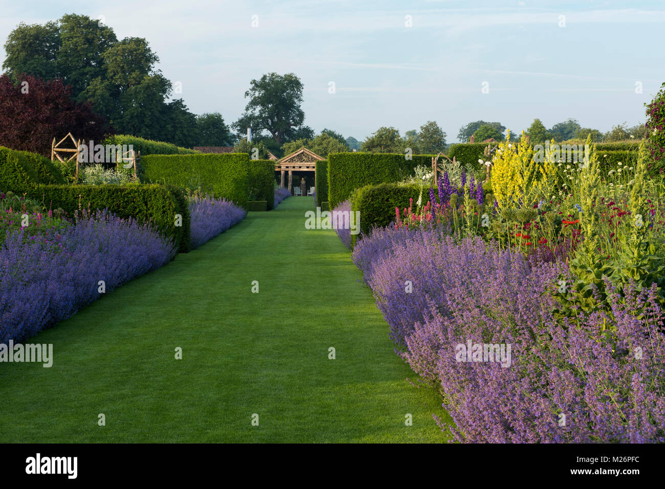 The long border lined with Nepeta leading to the Rustic Temple in the ...