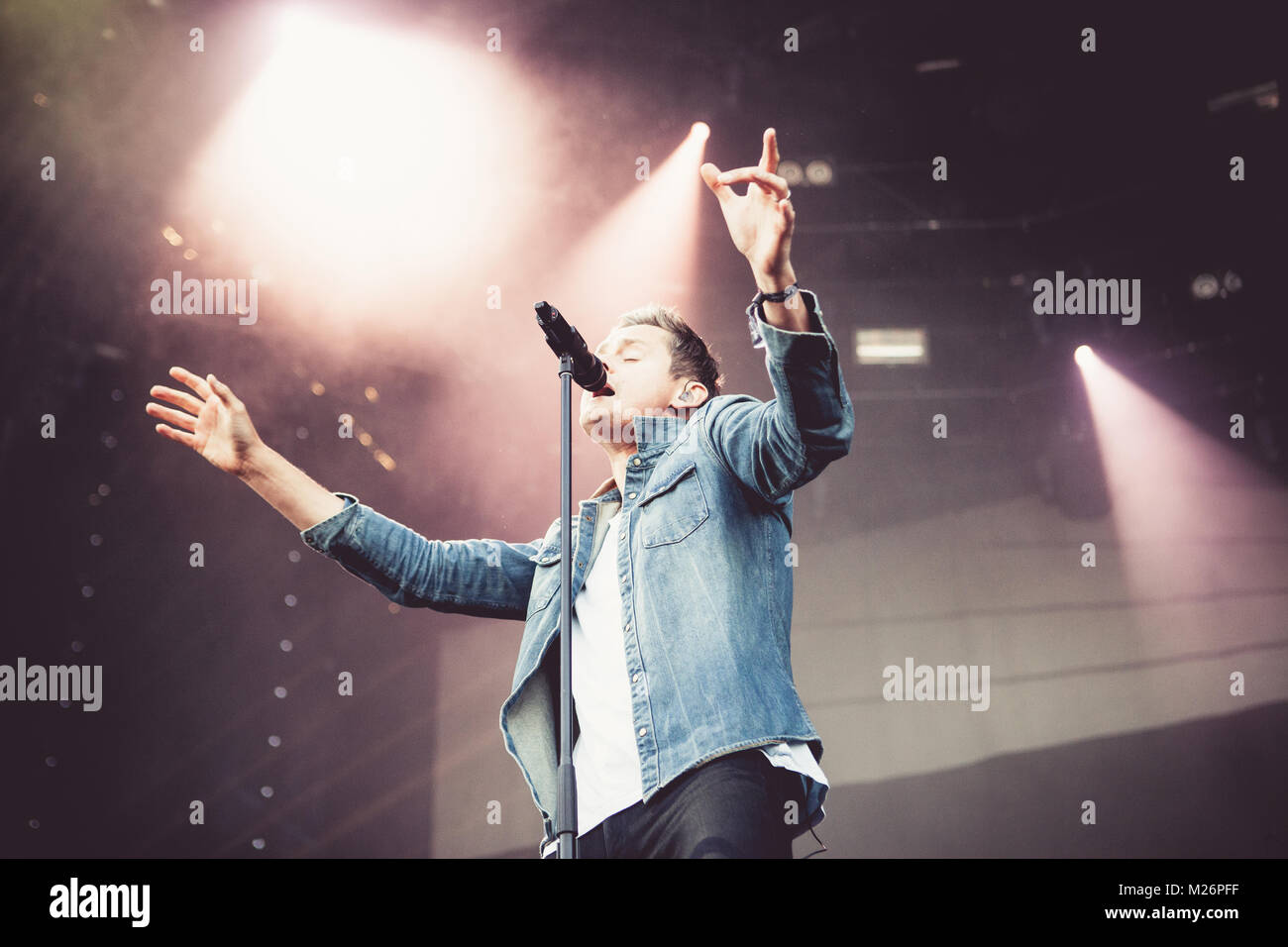 Lead singer and musician Tom Chaplin pictured with his arms the sides ...