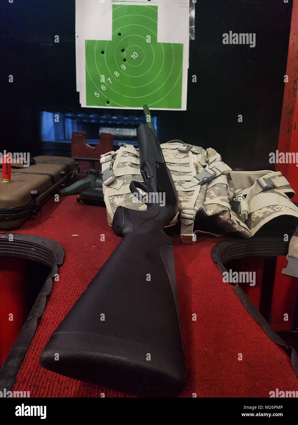 Photo of shooting gallery with target, gun, bulletproof vest Stock ...