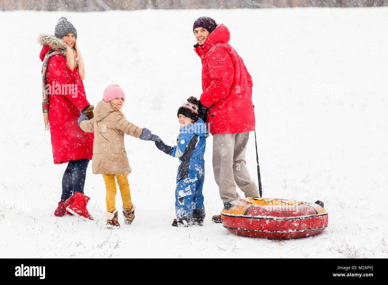 Couple snow tubing hi-res stock photography and images - Alamy